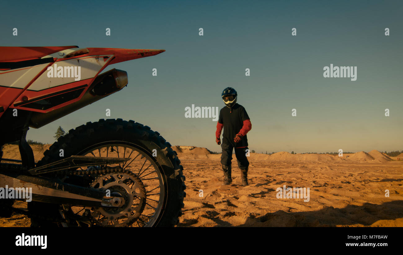 Front View Shot of the Professional Motocross Driver Saddles His FMX ...