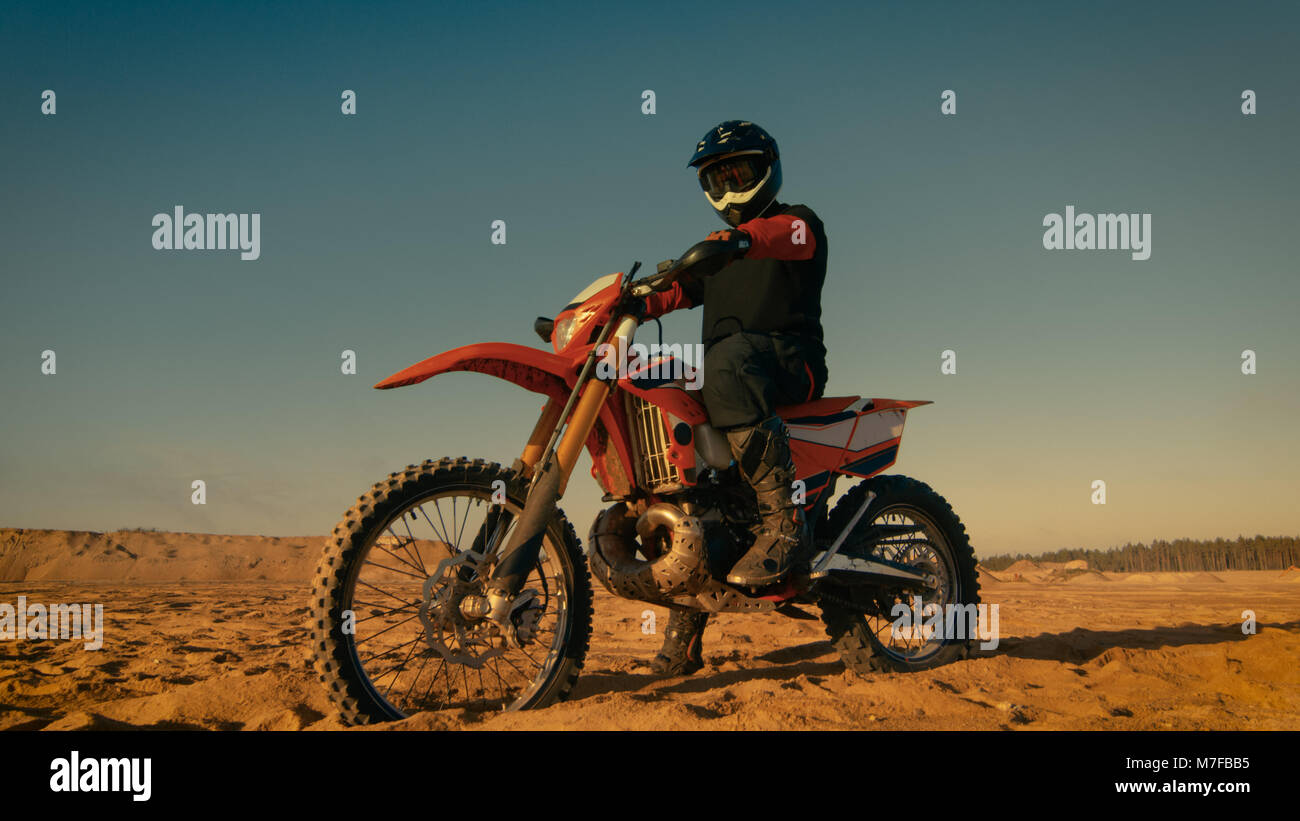 Shot of the Professional Motocross Driver Sitting on His FMX Dirt Bike ...