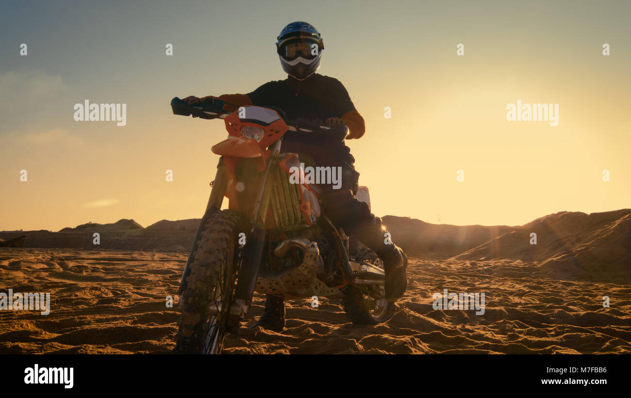 Front View Shot of the Professional Motocross Driver Saddles His FMX ...