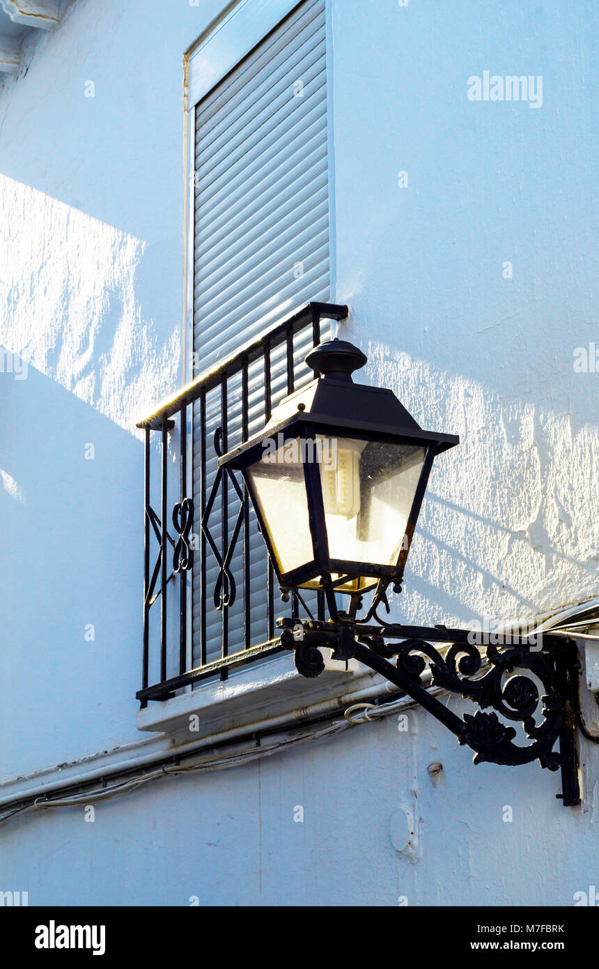 Stylish balcony with a metal railing, solid architectural element, a ...
