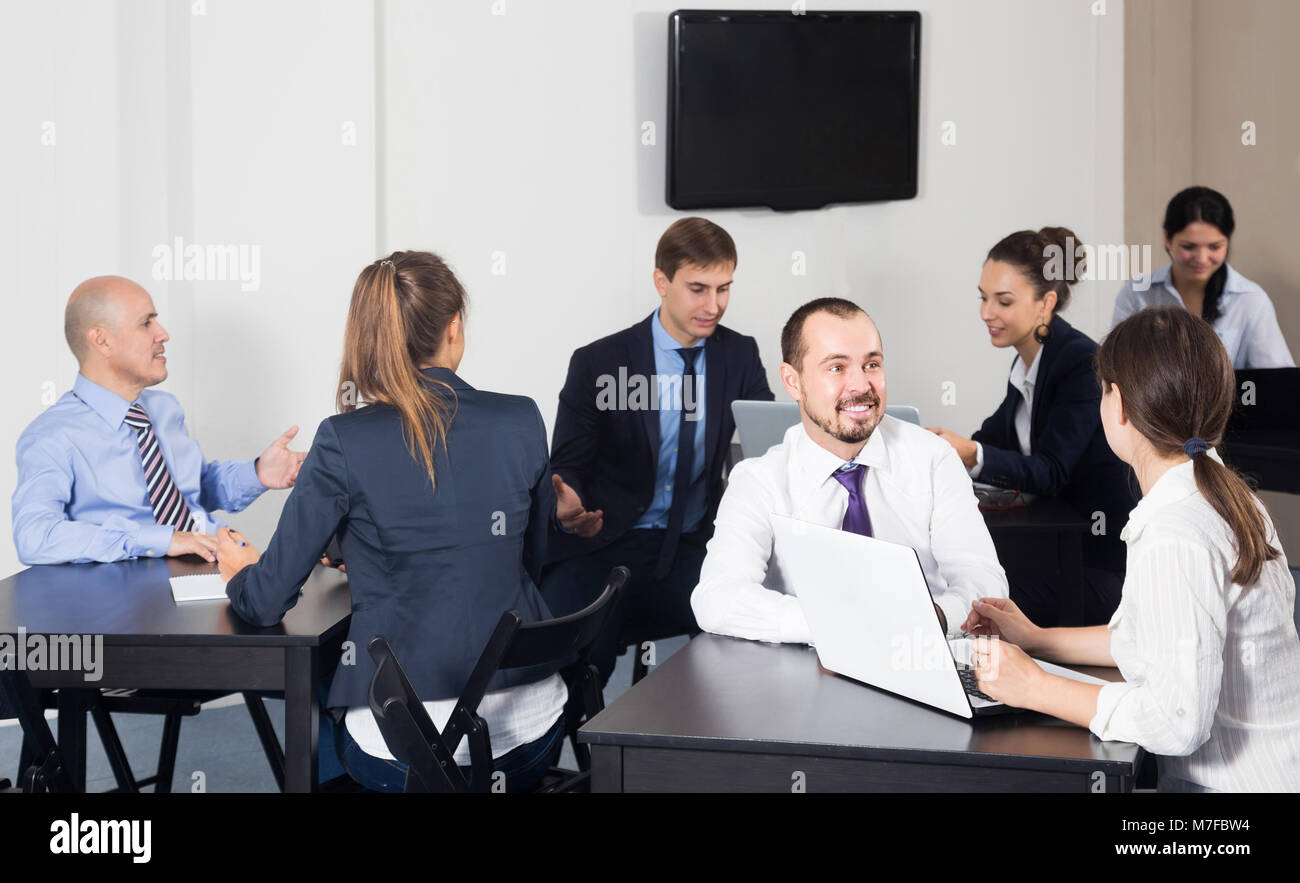 happy american people working productively on business project together ...
