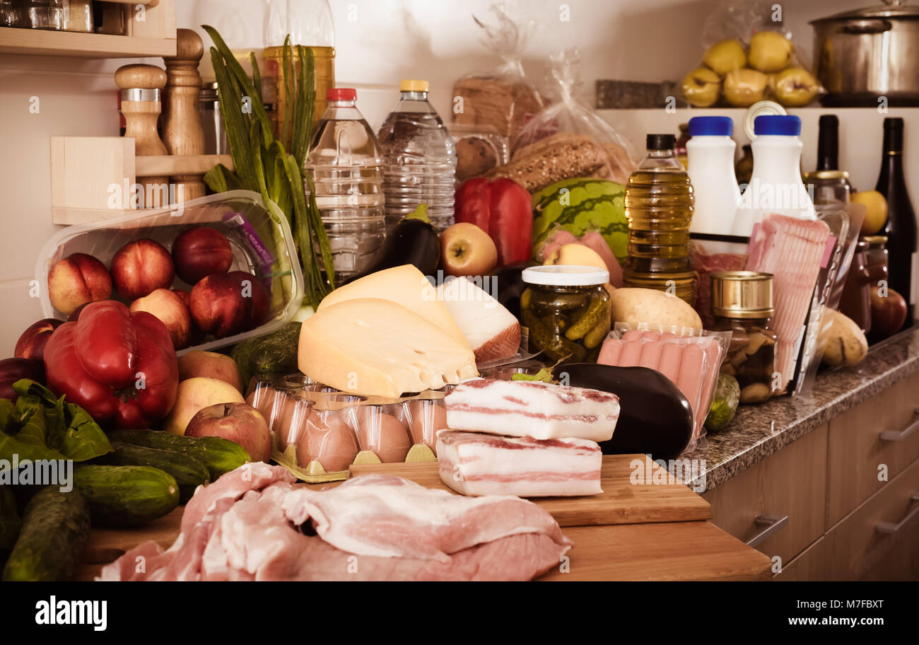 Image of full table of grocery on the kitchen at home Stock Photo - Alamy