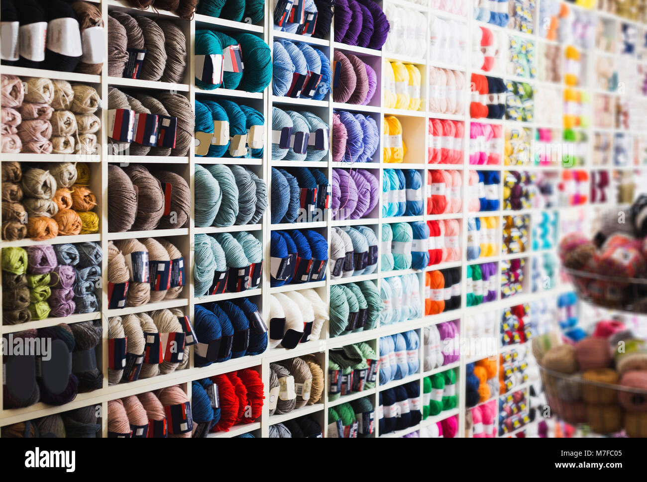 Shelves with beauty colorful wool and yarn in knitting shop Stock Photo ...