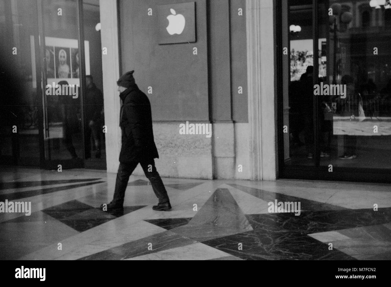 Senior man walking in front of the Apple Store Piazza della Repubblica ...