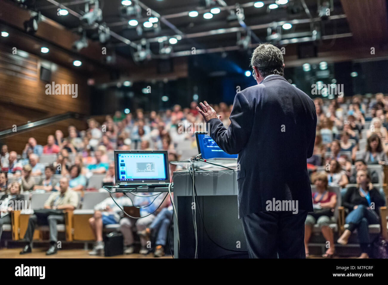 Public speaker giving talk at Business Event Stock Photo - Alamy