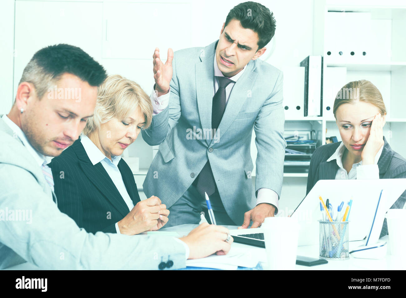 Businessman feeling angry to coworkers in office, pointing out mistakes ...