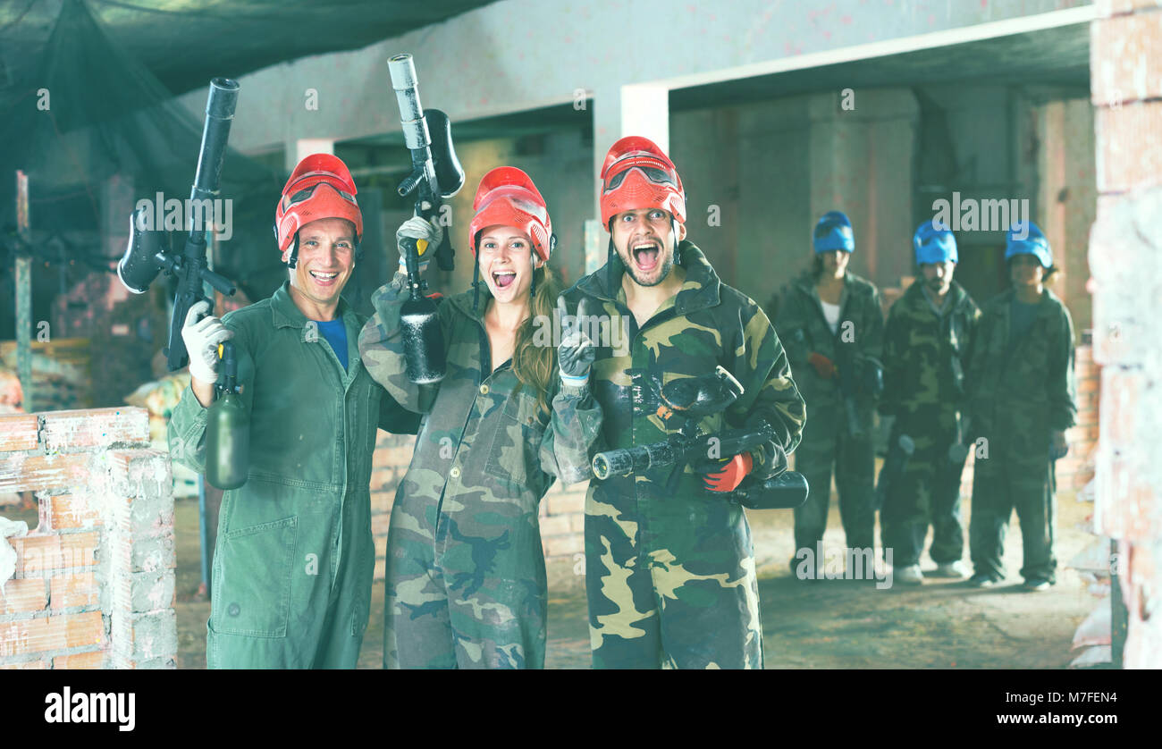 Team in red is celebrating the victory in the paintball club Stock ...