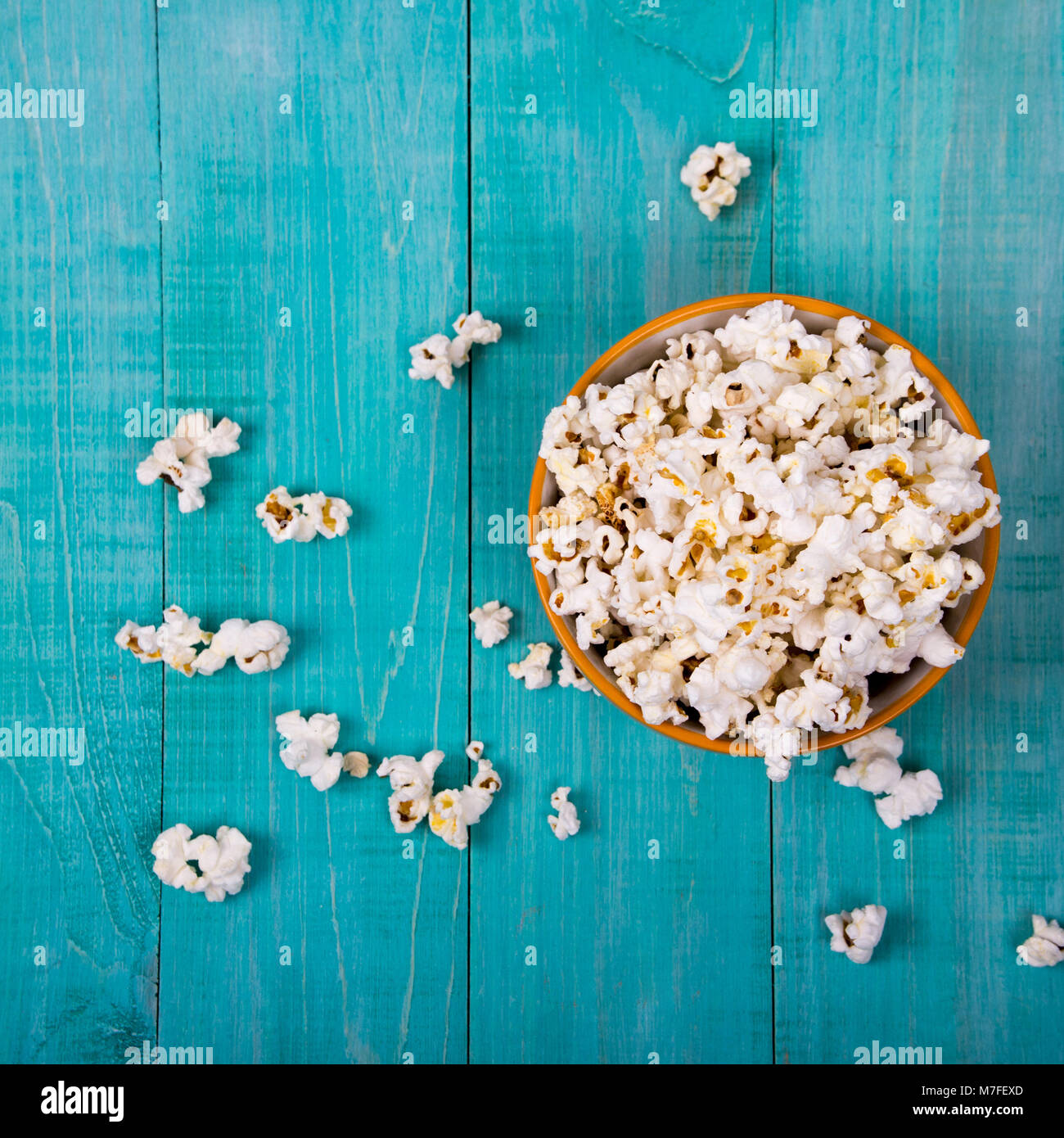 Popcorn explosion on blue background, Popcorn on blue top view copy ...