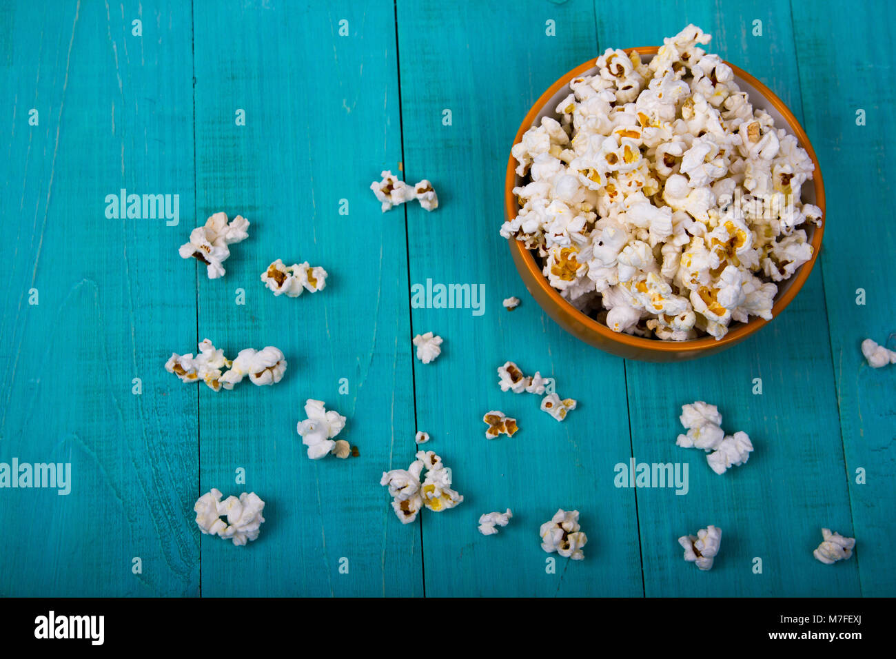 Popcorn explosion on blue background, Popcorn on blue top view copy ...