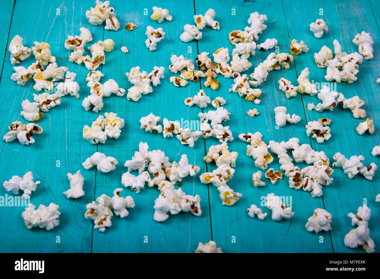 Popcorn explosion on blue background, Popcorn on blue top view copy ...