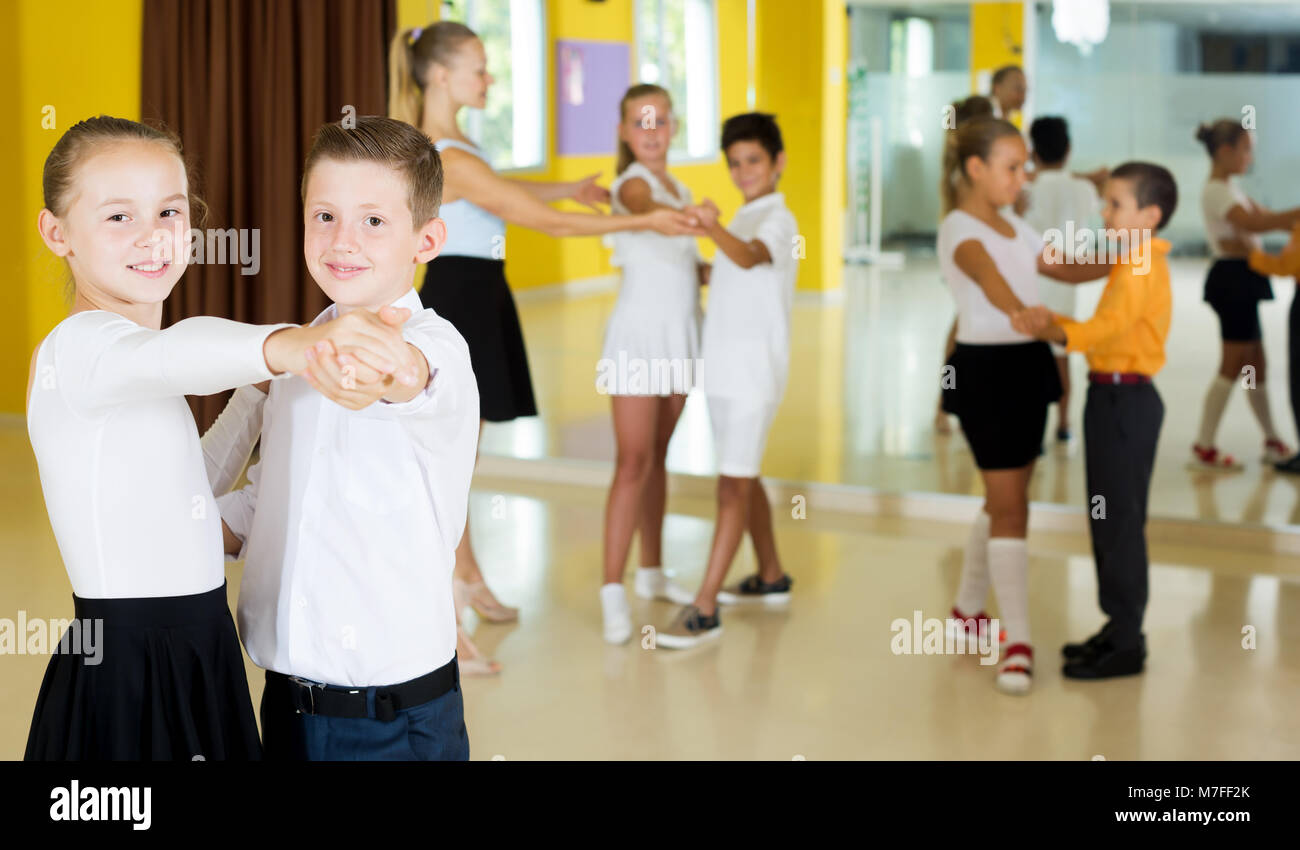 Glad children studying of partner dance at dance school Stock Photo - Alamy