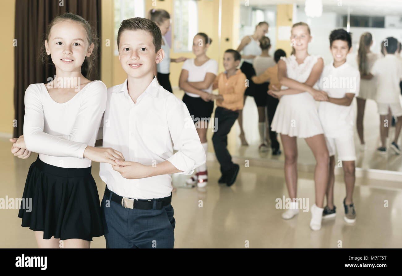 Diligent smiling boys and girls having dancing class in classroom Stock ...
