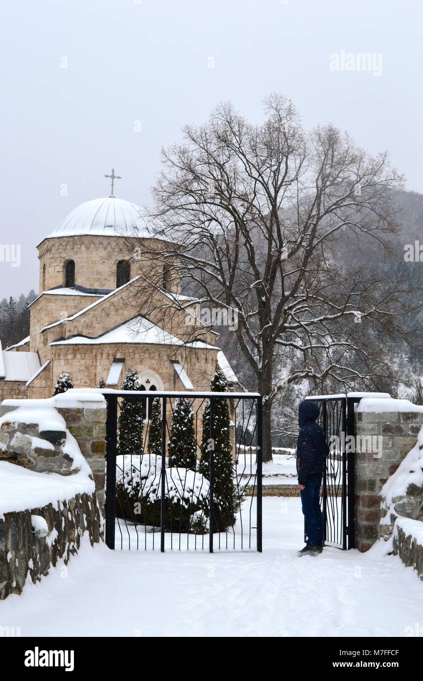 a man at the gate of the monastery Stock Photo - Alamy
