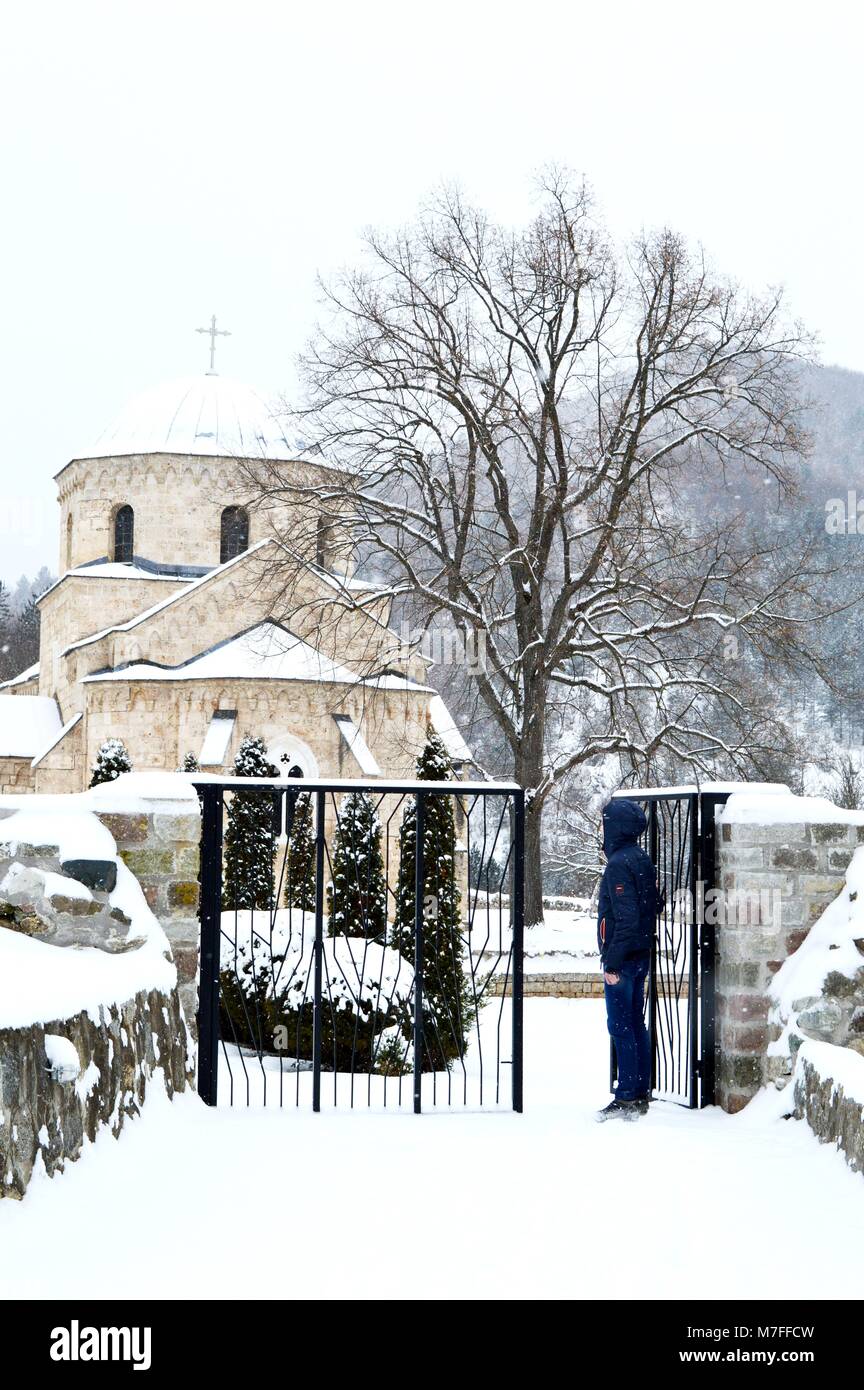 a man at the gate of the monastery Stock Photo - Alamy