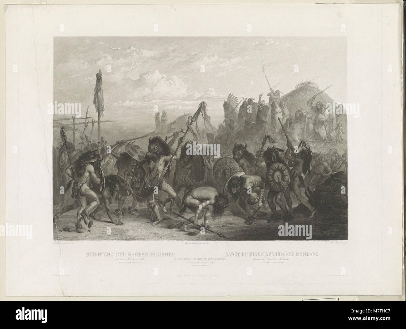 The image depicts a traditional Bison Dance performed by the Mandan ...