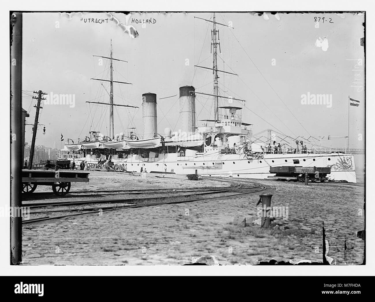 The ship *Utrecht* of Holland is shown docked at a pier, representing ...