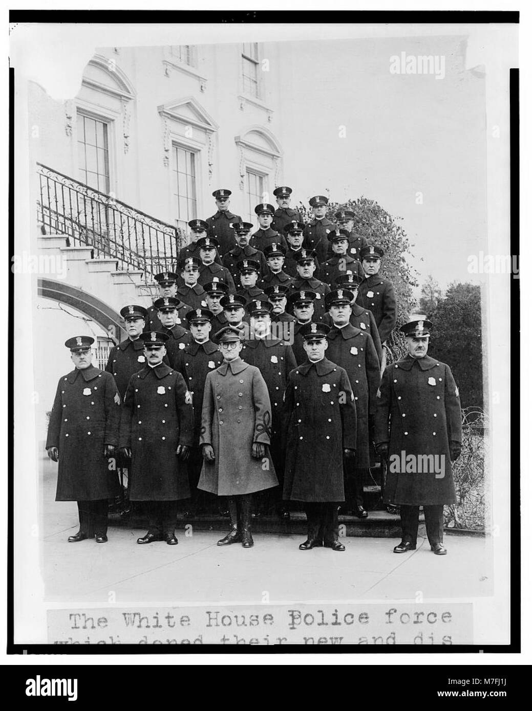 A historical photograph of the White House police force, captured in ...