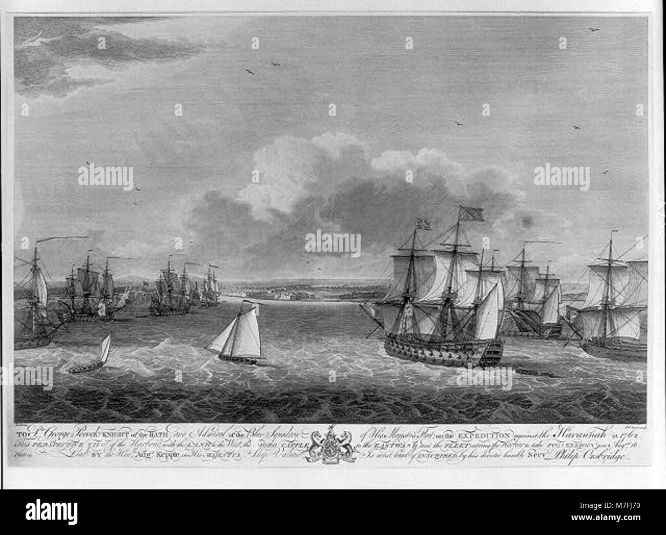 The photograph captures a perspective view of a harbour, with the land ...