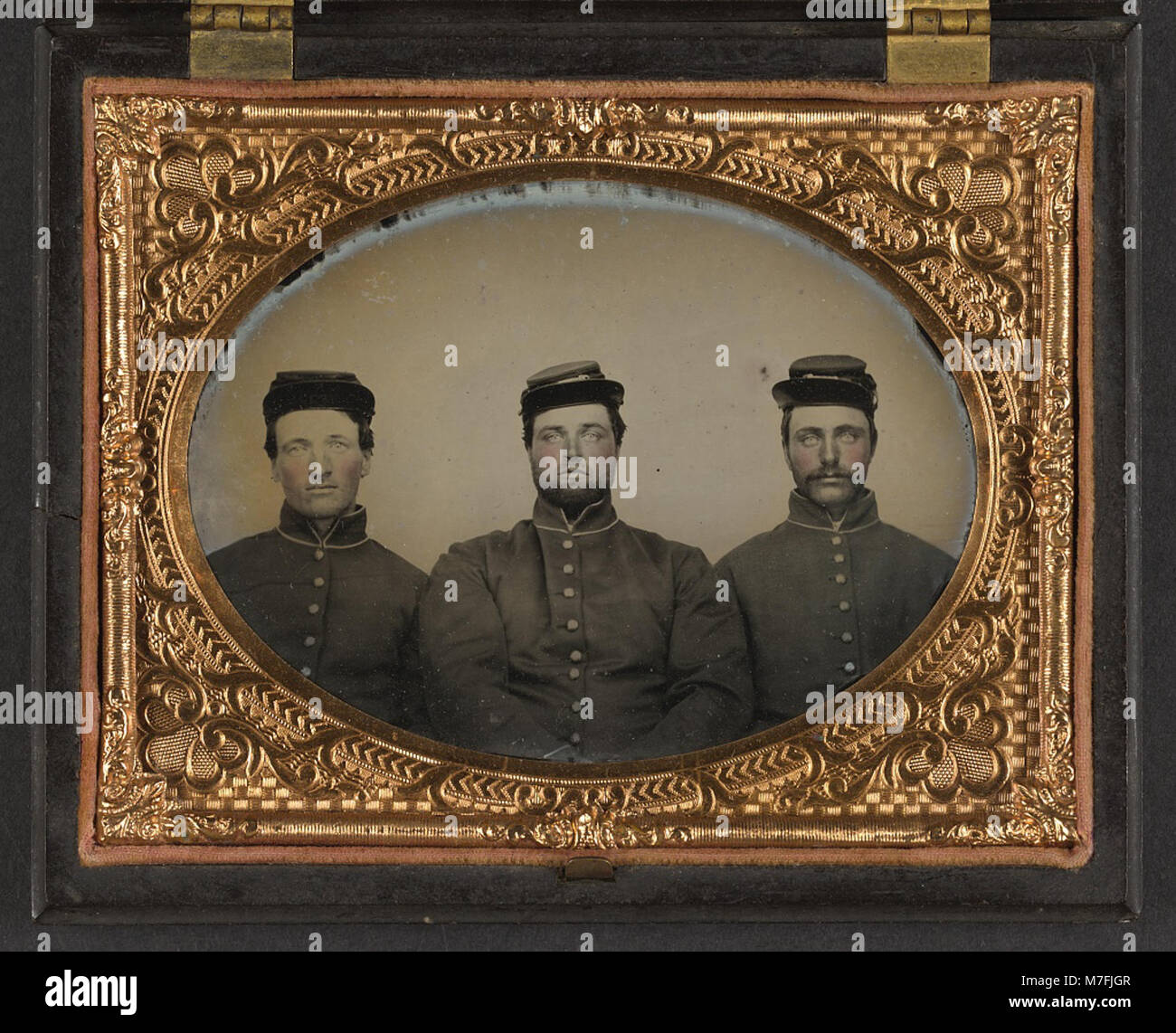 A historical photograph of three unidentified Union soldiers wearing ...