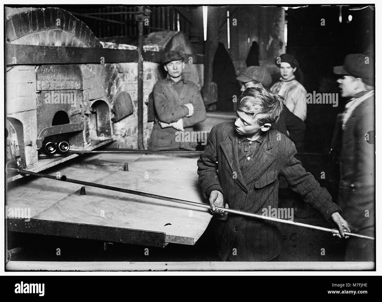 This photograph depicts a boy working at Wormser’s Glass House for ...
