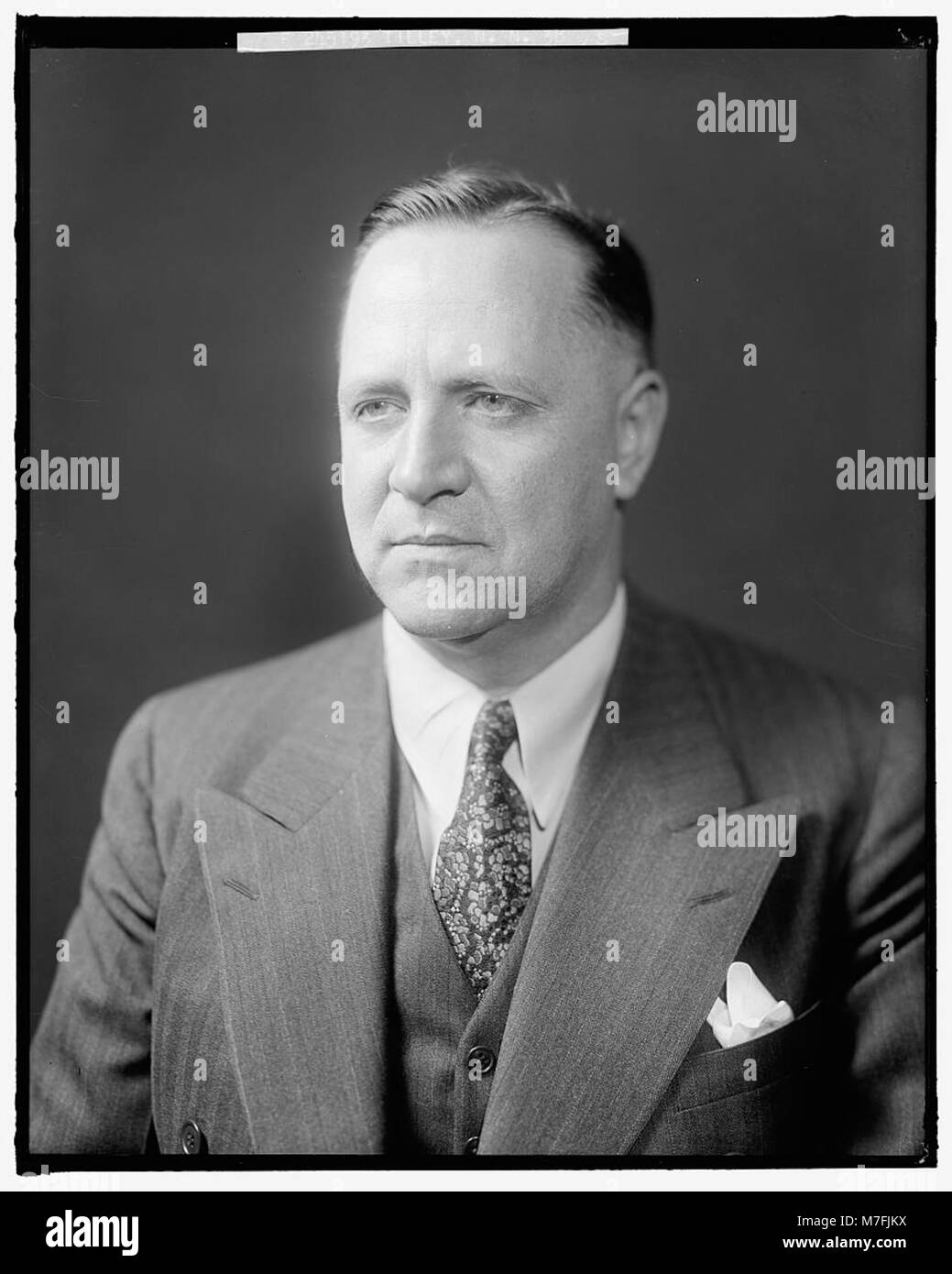 A formal portrait of N.N. Tilley, a notable individual, captured in a ...