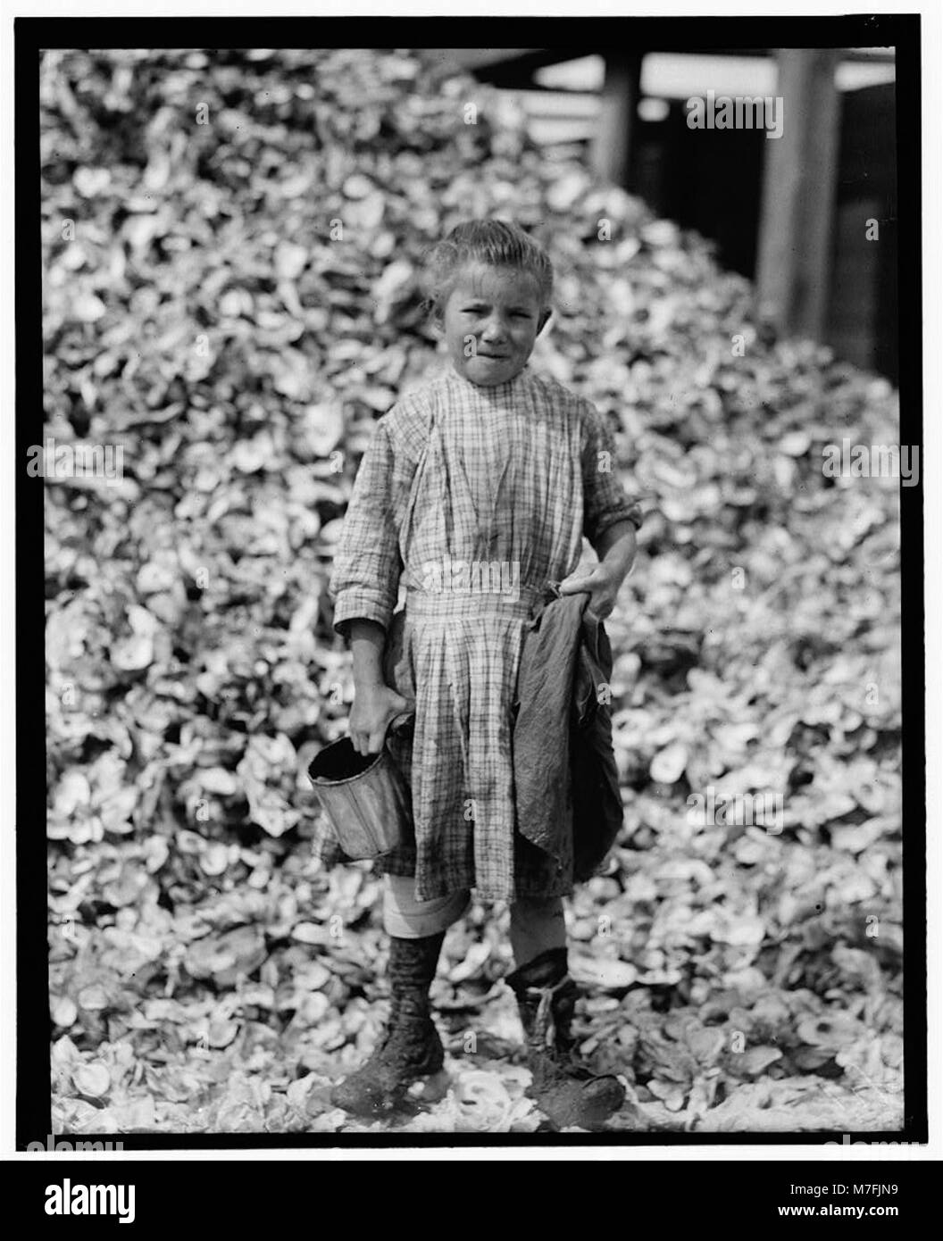 Tiny, seven year old oyster shucker (Henry's sister, No. 3291) does not ...