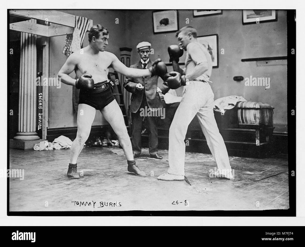 Tommy Burns, the heavyweight boxing champion, captured in action during ...