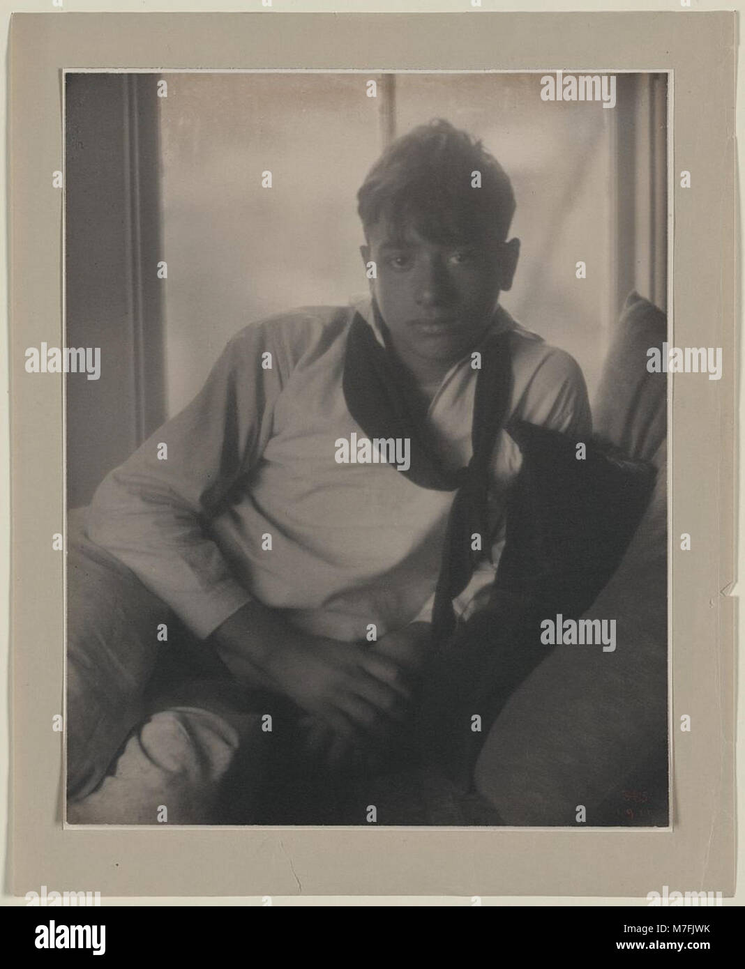 A portrait of Tony Costanza dressed in a sailor suit, seated and ...
