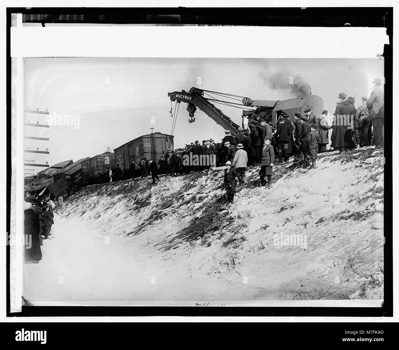 A photograph showing the aftermath of a train derailment, illustrating ...