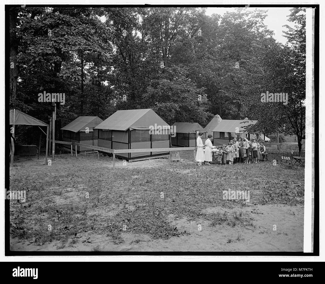 A photograph of a tuberculosis camp, showing individuals undergoing ...
