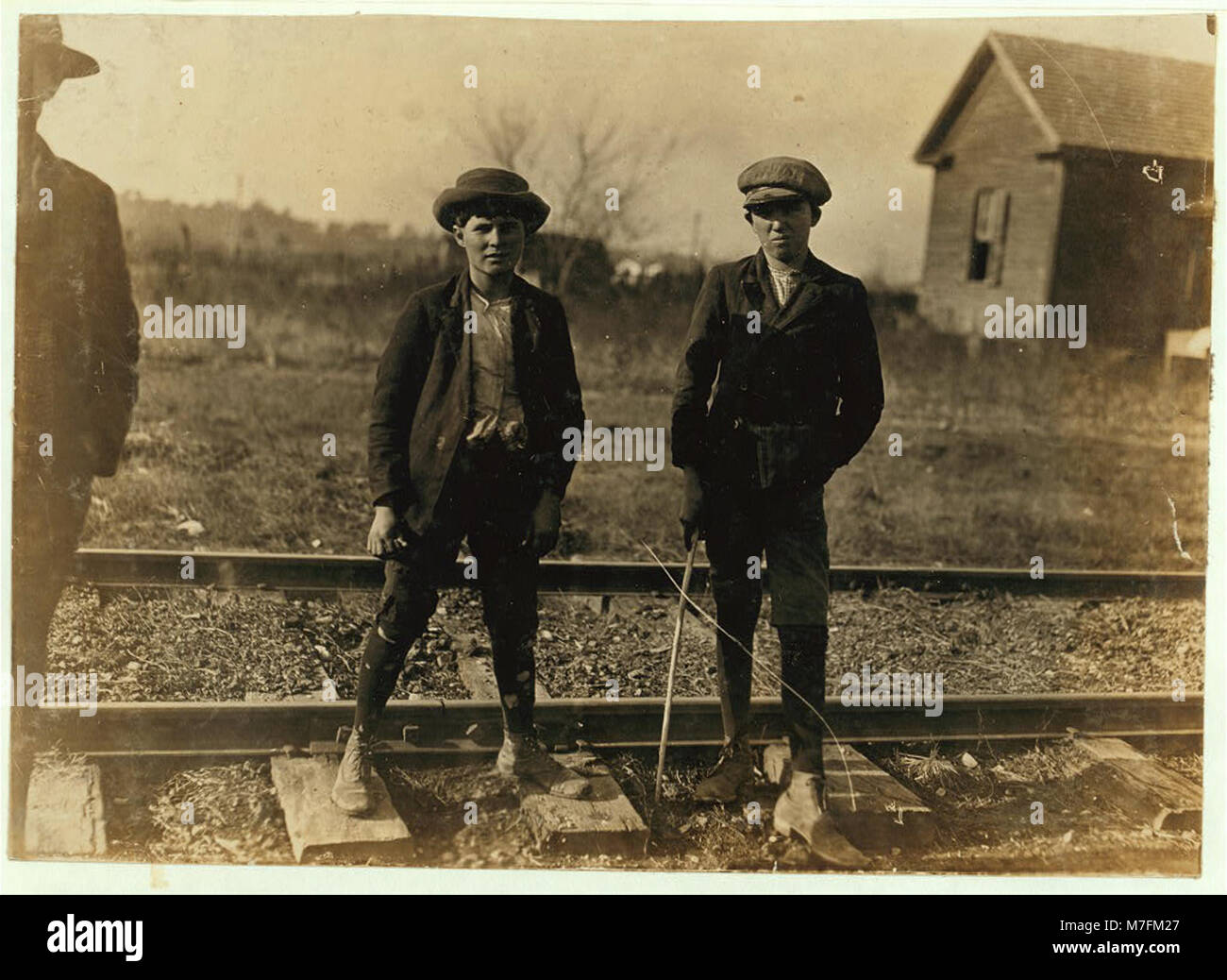Two textile workers, described as spinners, are pictured in Dillon Mill ...