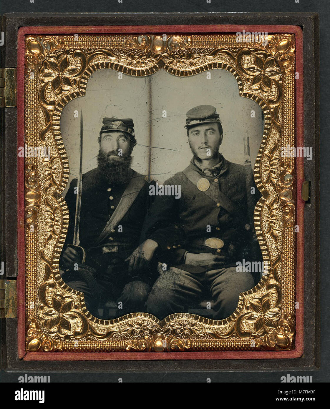 A photograph of two unidentified Union soldiers wearing forage caps ...