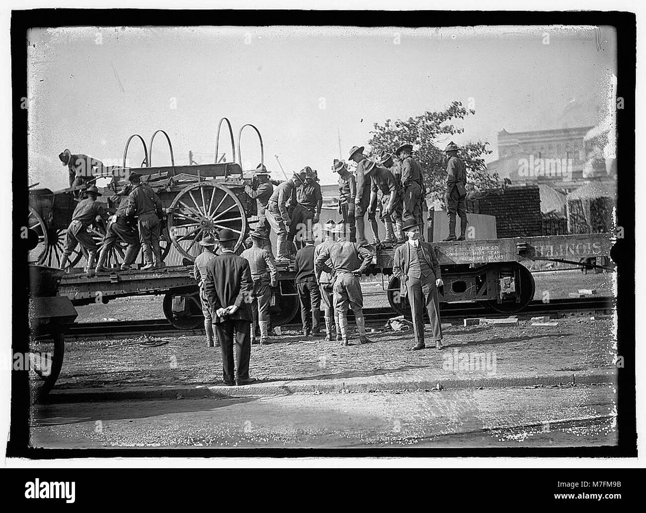 A historical photograph showing the U.S. Army transporting equipment ...