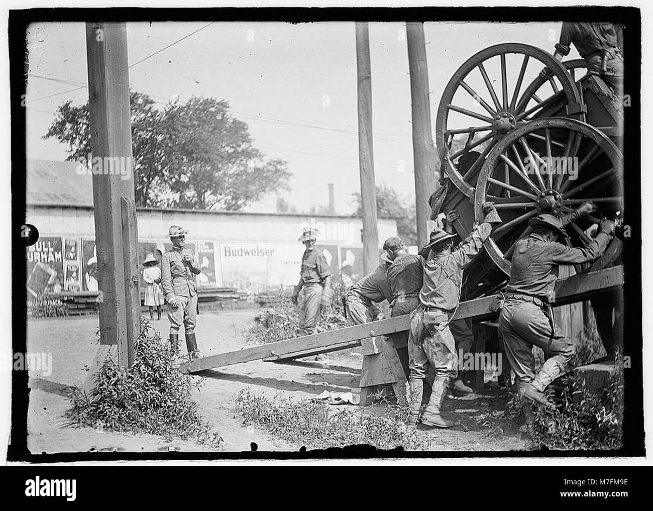 This photograph captures U.S. Army soldiers transporting military ...