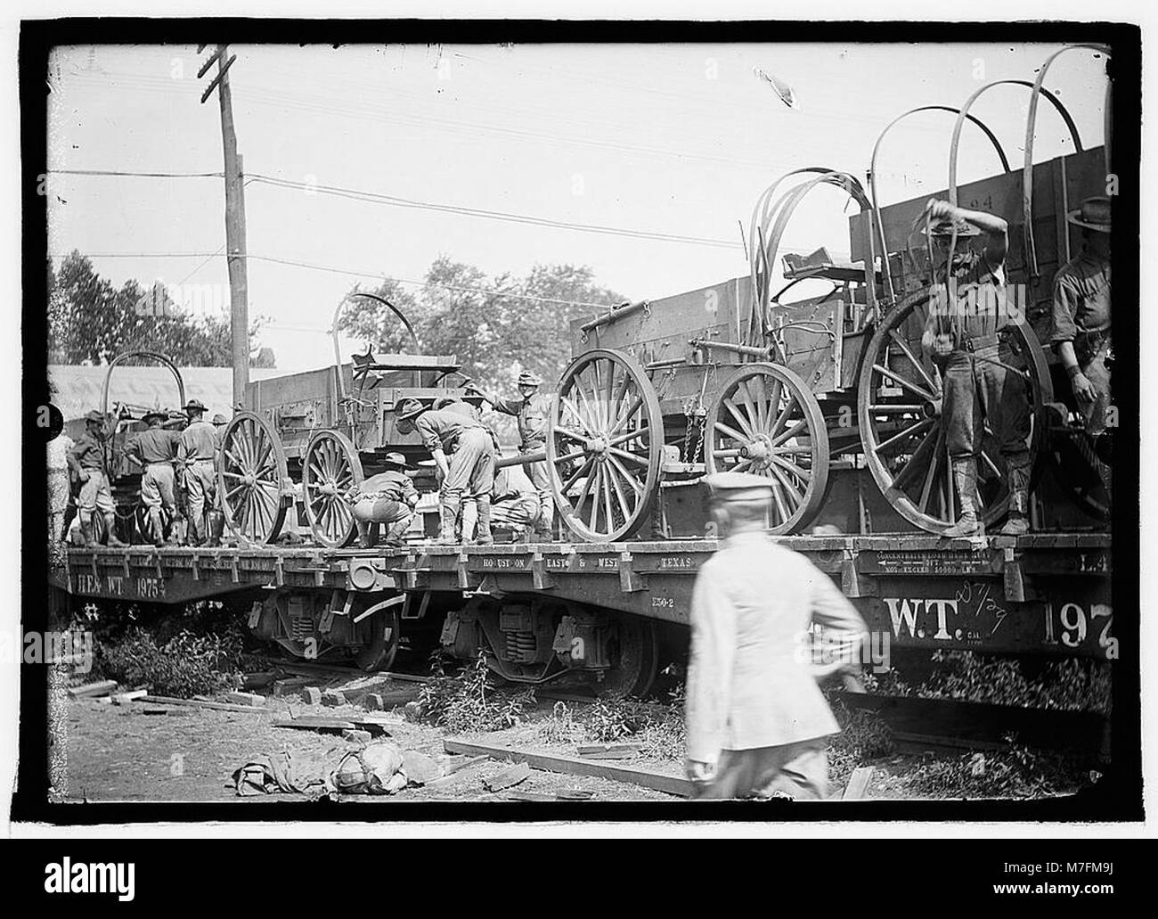 The photograph shows U.S. Army personnel involved in the transportation ...