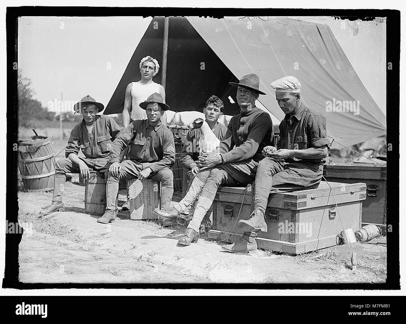 This photograph depicts a group of U.S. Army soldiers standing in front ...