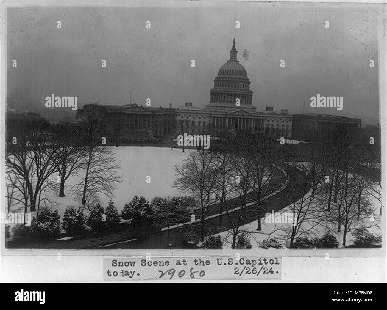 A winter scene showing the east front and grounds of the U.S. Capitol ...
