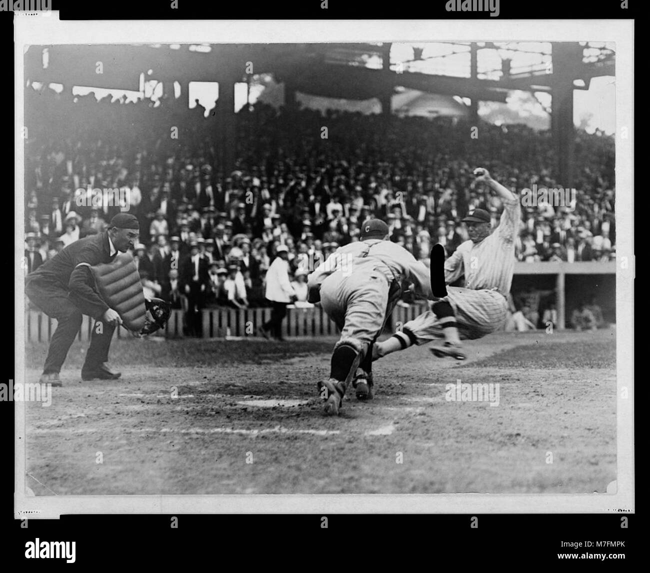 A dramatic moment in a baseball game, where the umpire is ready to make ...