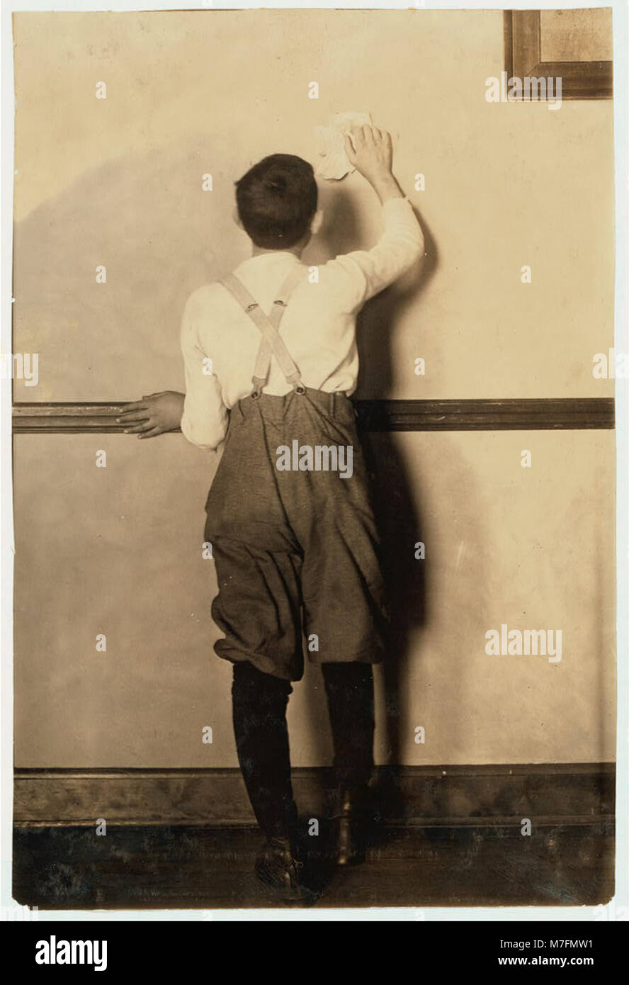 This photograph highlights a boy in an unfavorable working position ...