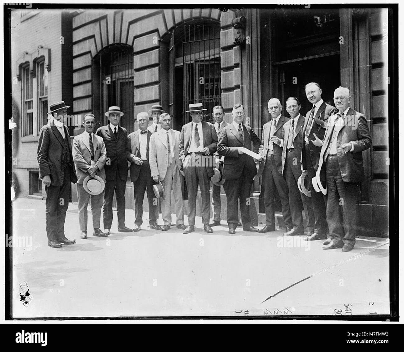 This unidentified group portrait captures individuals in a social ...