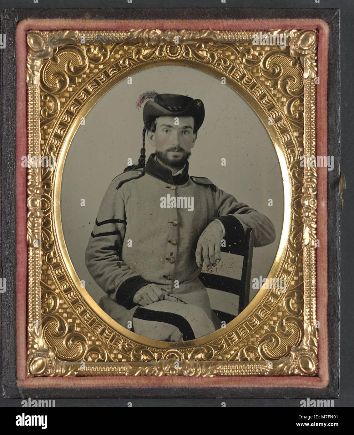 A portrait of an unidentified corporal in a Confederate uniform ...