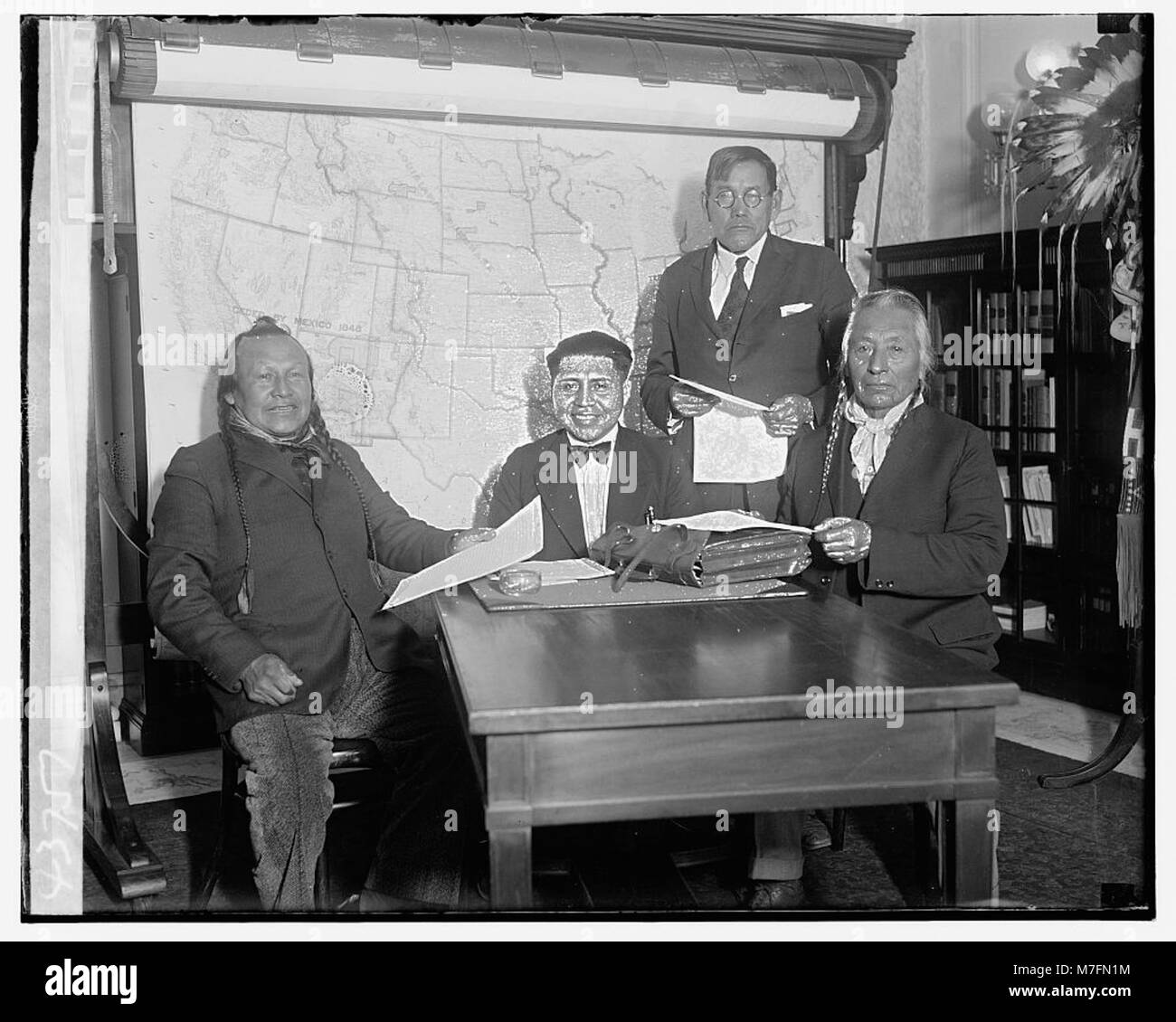 This image features an unidentified individual, captured in a formal ...