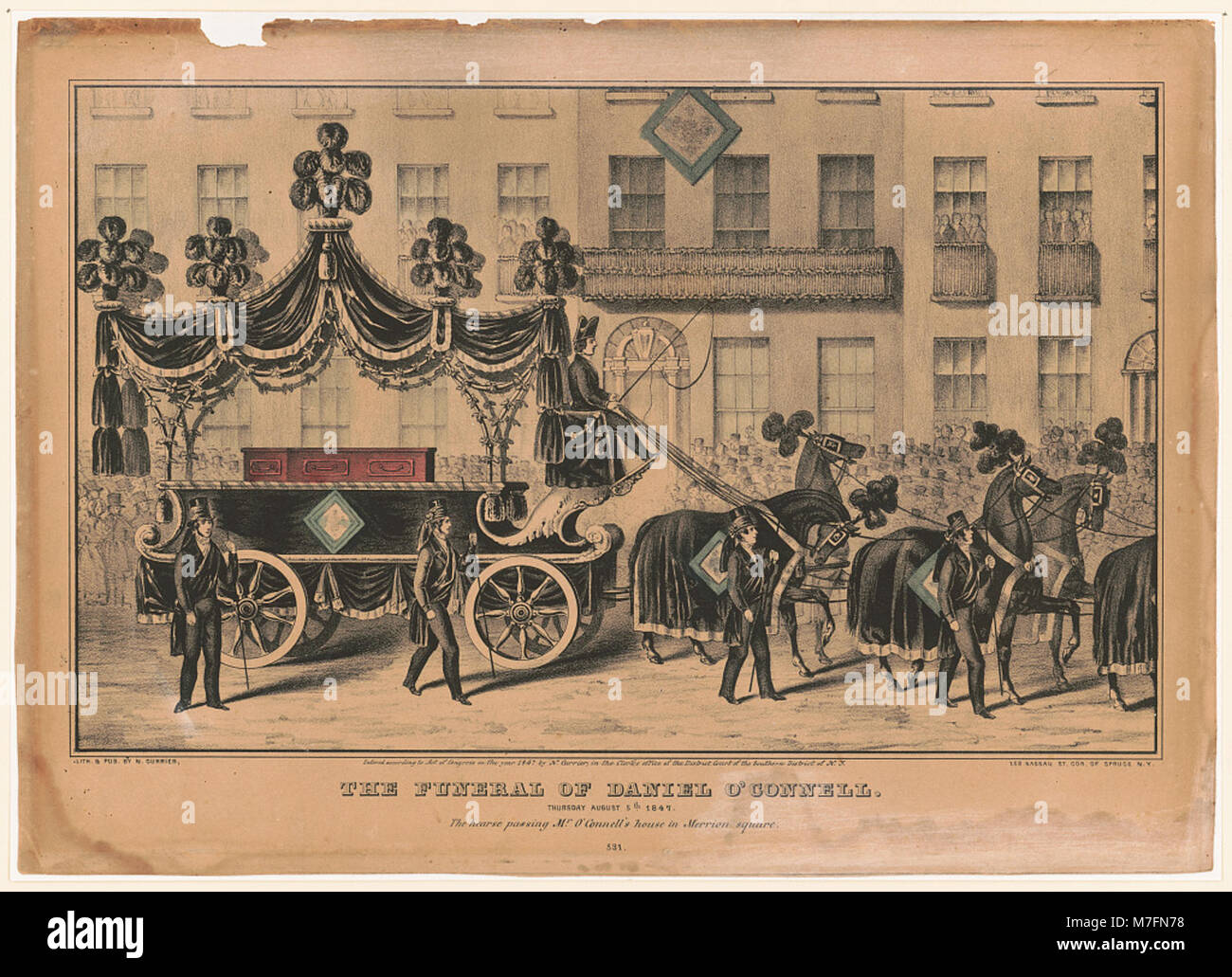 This historical photograph captures the funeral procession of Daniel O ...