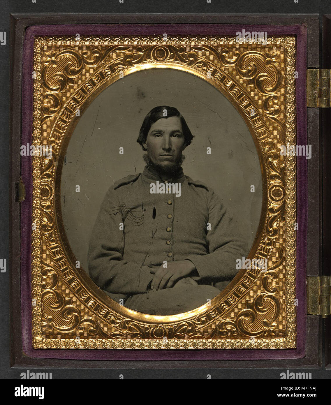 A portrait of an unidentified Confederate soldier wearing a shell ...