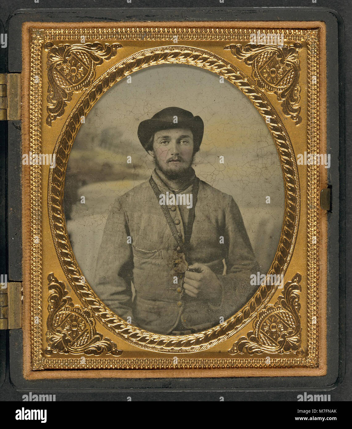 This photograph shows an unidentified soldier wearing a Confederate ...