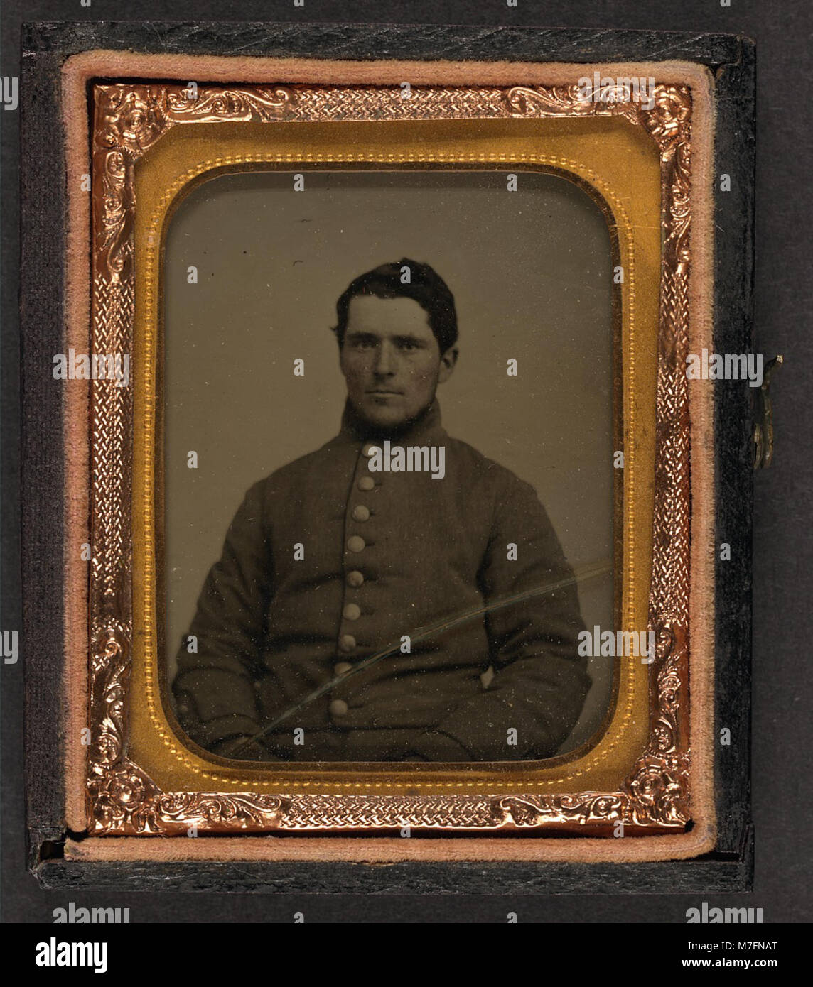 An unidentified soldier wearing a Confederate shell jacket, likely from ...