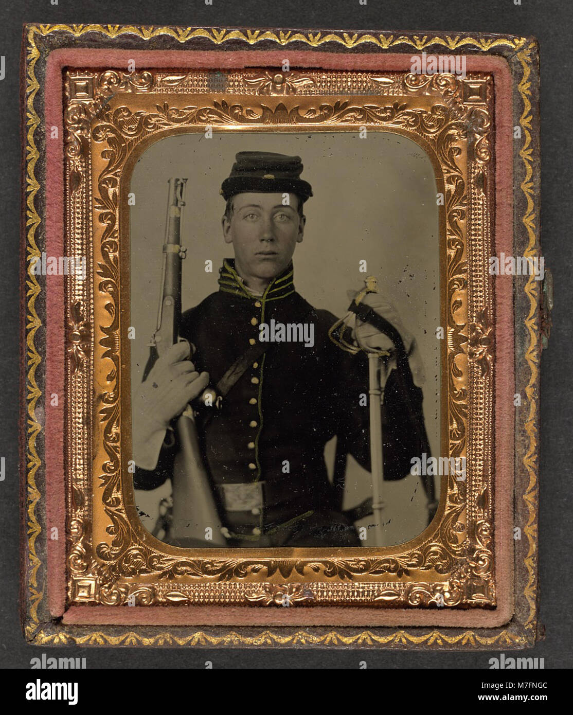 An unidentified Union cavalry soldier is shown in full uniform, holding ...