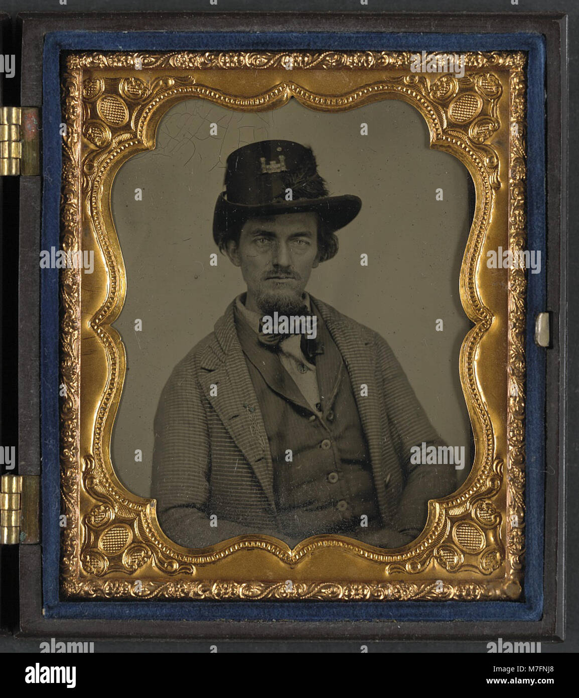 An unidentified soldier wearing a Union Hardee hat, with an engineer's ...