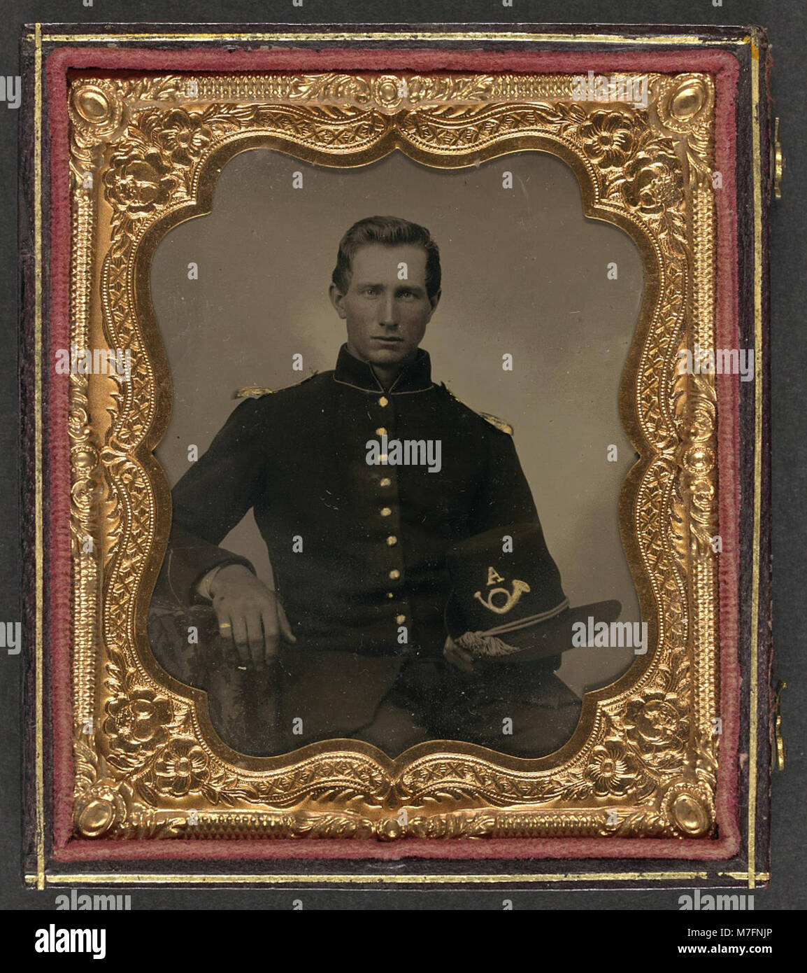 A photograph of an unidentified soldier wearing a Union infantry ...