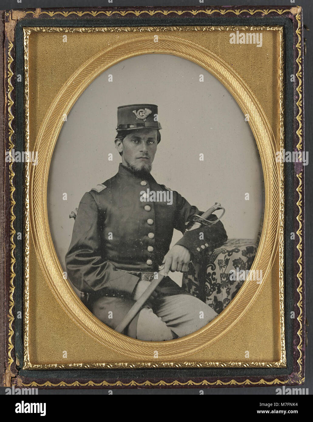 An unidentified Union officer stands in full uniform, holding a sword ...